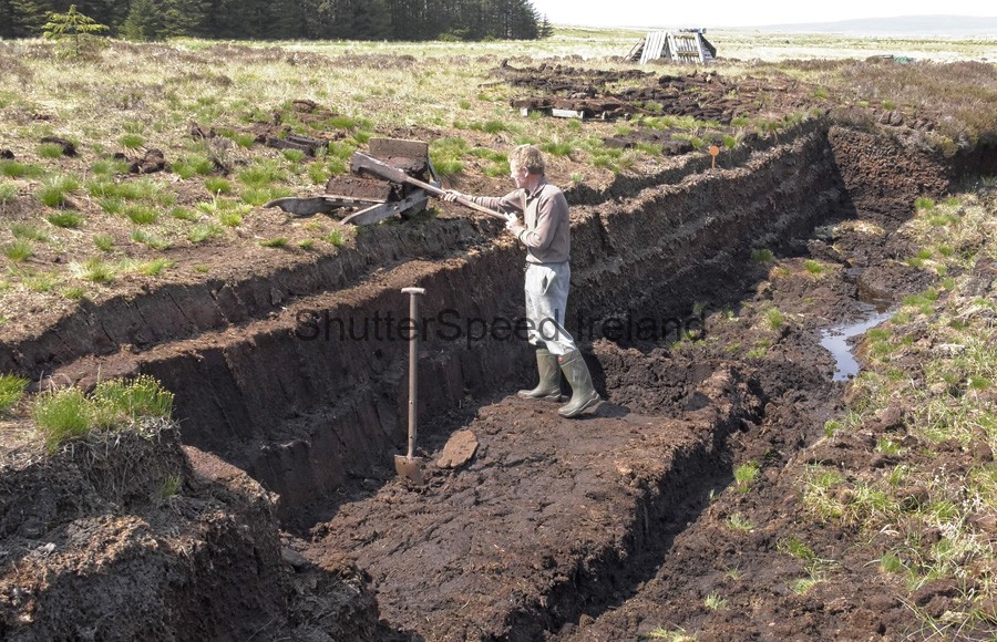 Cutting Turf Peat by spade in a Moss Bog in Ireland 14 Stock Photo ...